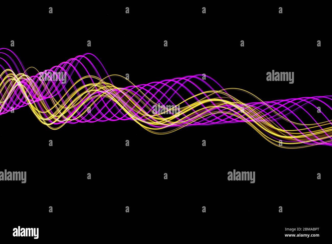 Long exposure photograph of neon colour in an abstract swirl, parallel ...