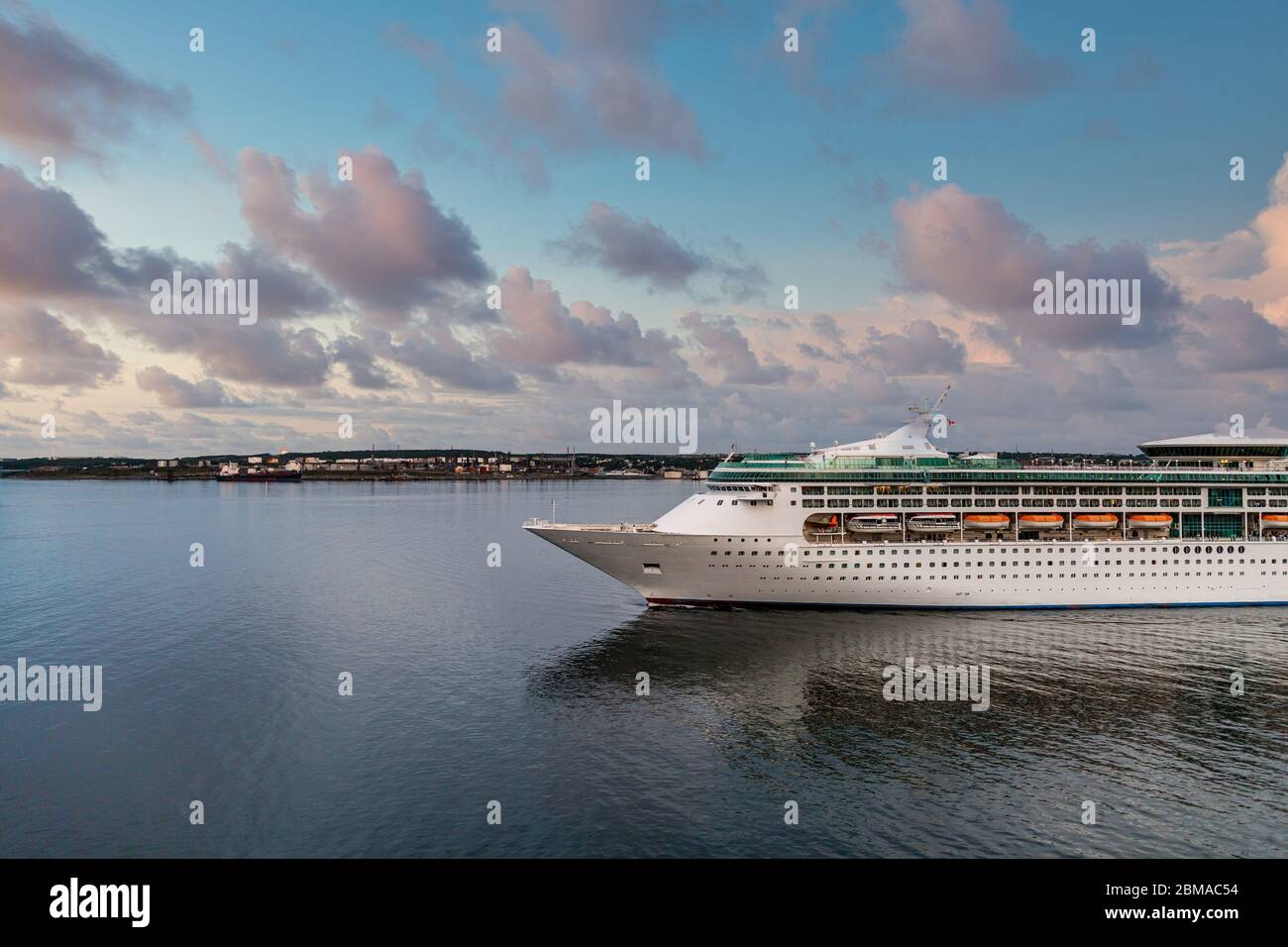 Cruise Ship Setting Sail Under Dusk Skies Stock Photo - Alamy