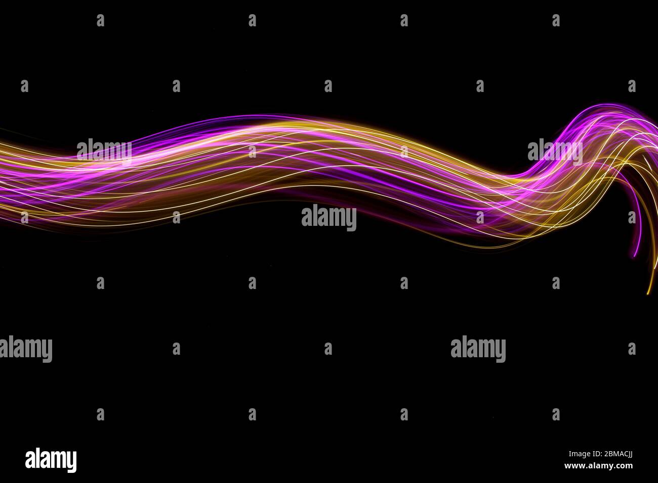 Long exposure photograph of neon colour in an abstract swirl, parallel ...