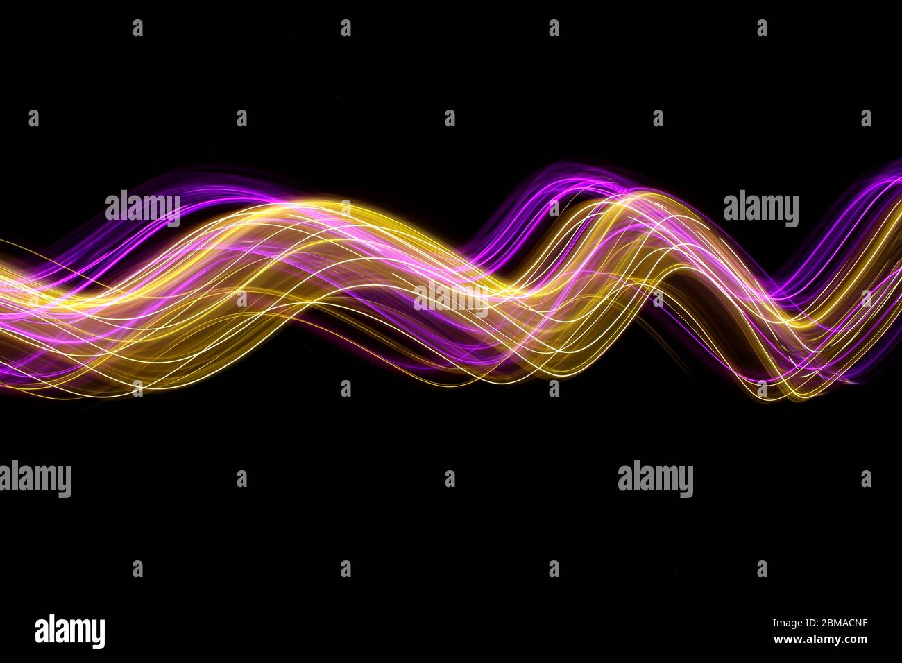 Long exposure photograph of neon colour in an abstract swirl, parallel ...