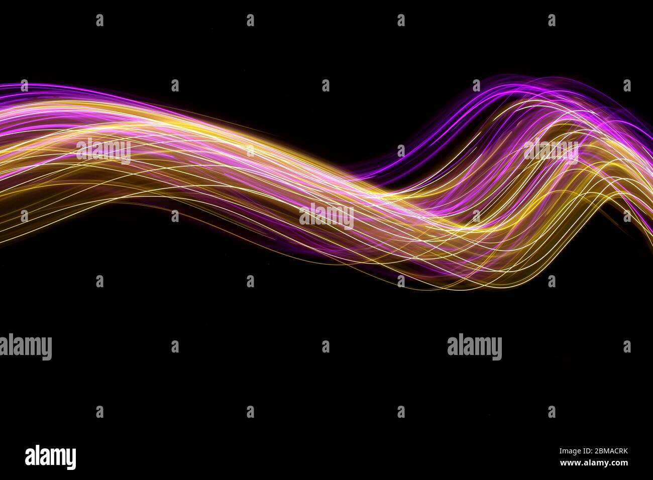 Long exposure photograph of neon colour in an abstract swirl, parallel ...