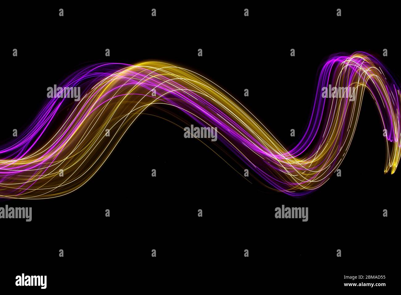 Long exposure photograph of neon colour in an abstract swirl, parallel ...