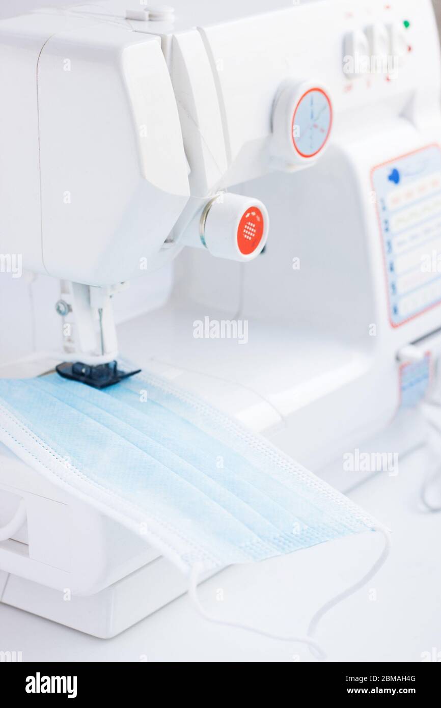 Sewing machine to make mask face fabric. Health care, and coronavirus ...
