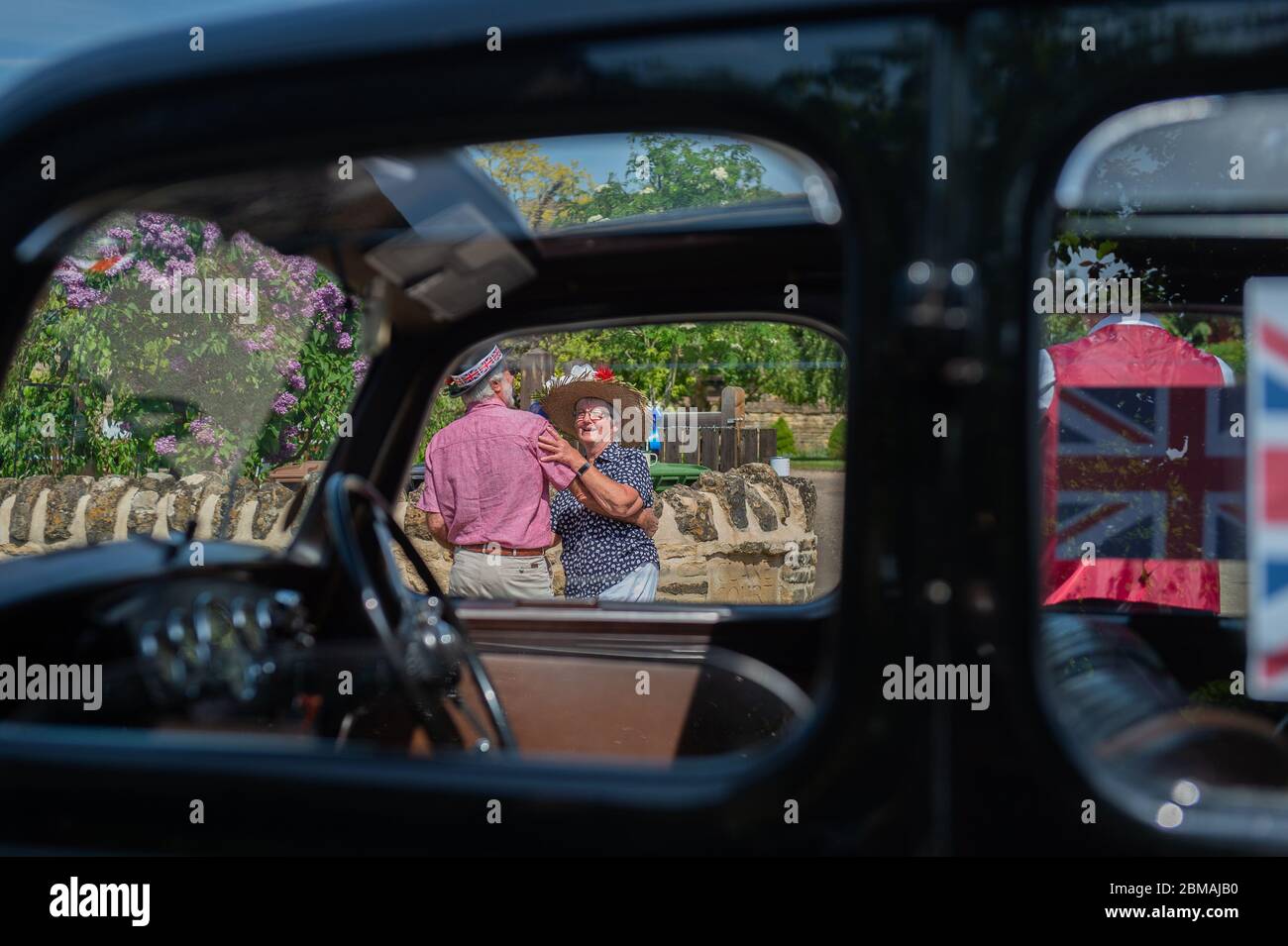 John and Kate Conder seen dancing through the window of a vintage car ...