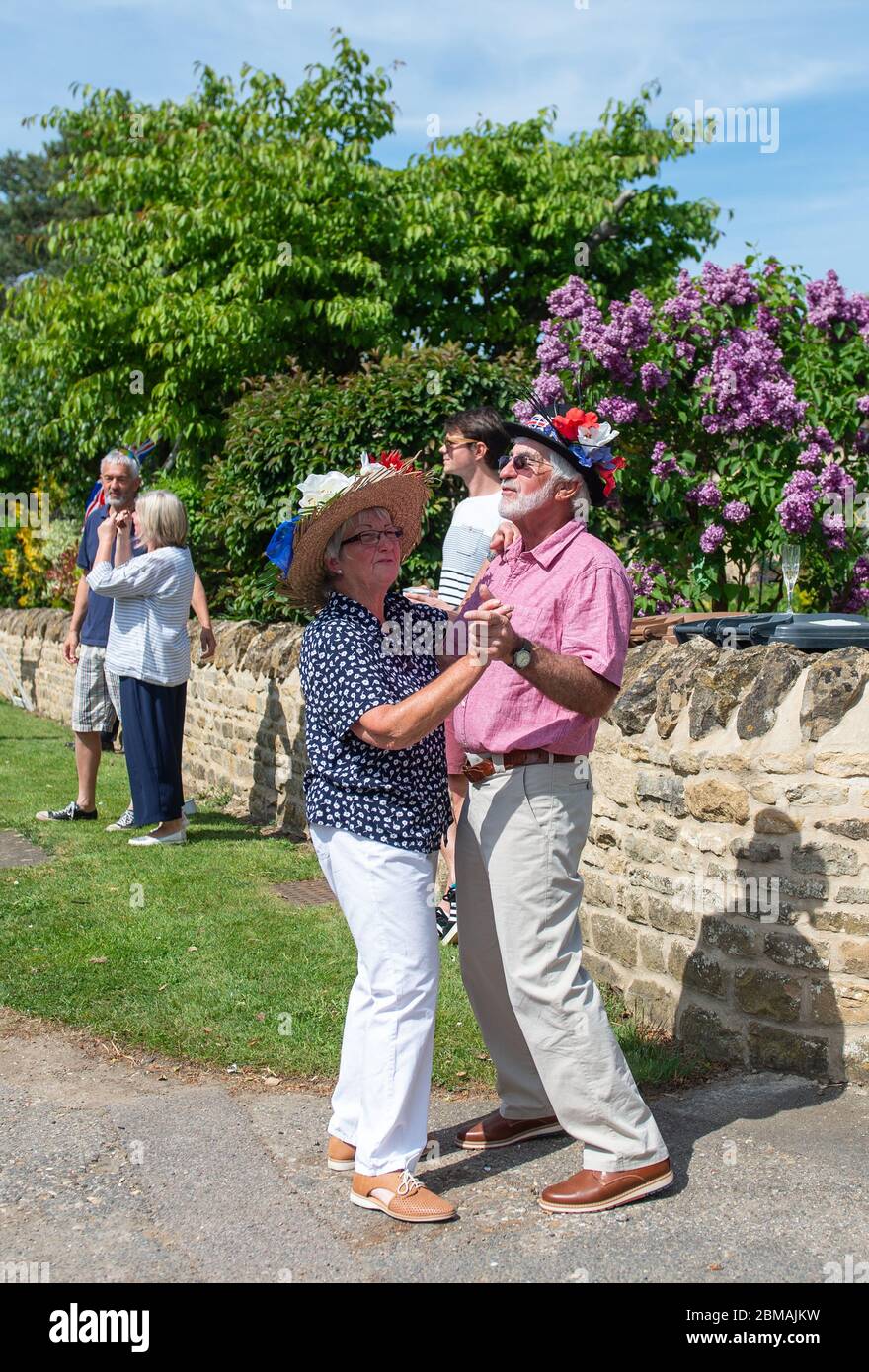John and Kate Conder dance outside their house in Helpston near ...