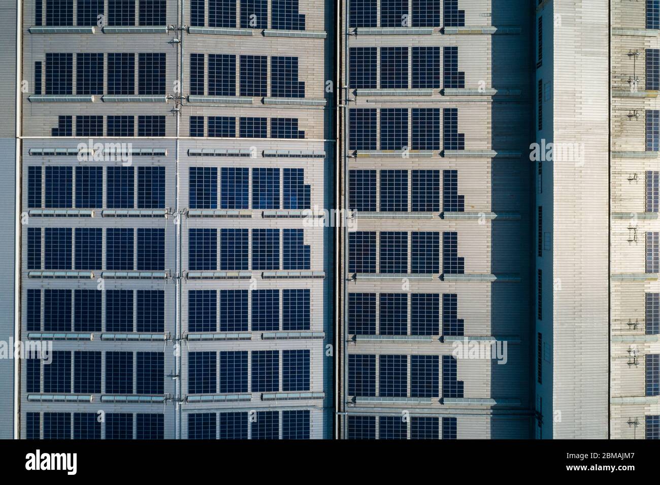 aerial view of factory roof with solar panels Stock Photo - Alamy