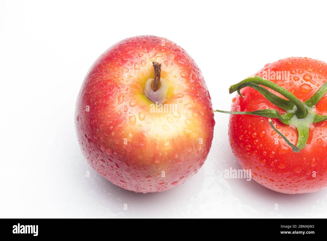 Tomatoes and apples, red fruits, for salads to eat raw, full of ...