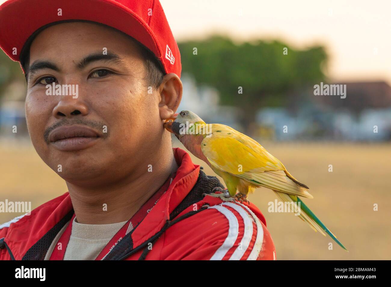 Yogyakarta, Indonesia - July 16, 2019: A young boy carries a playful ...