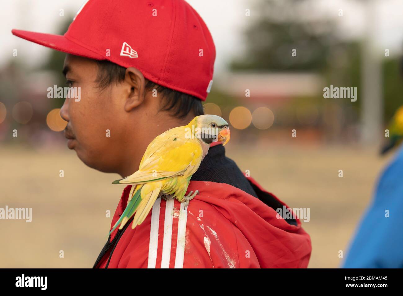Yogyakarta, Indonesia - July 16, 2019: A young boy carries a playful ...