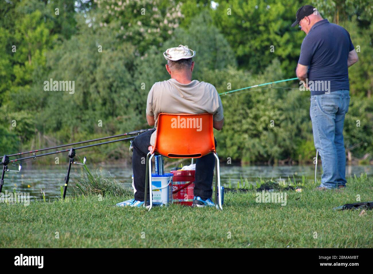 Two men fishing lake in hi-res stock photography and images - Alamy