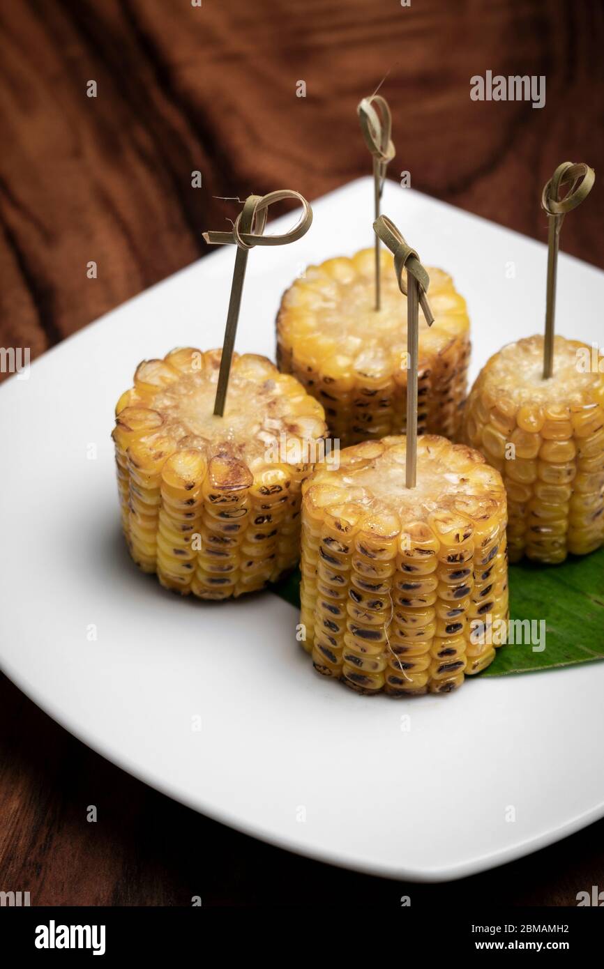 sweet corn on the cob vegetarian tapas snack food Stock Photo - Alamy