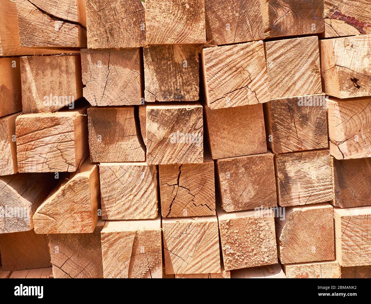 Stack of wooden squared beams background or texture concept Stock Photo ...