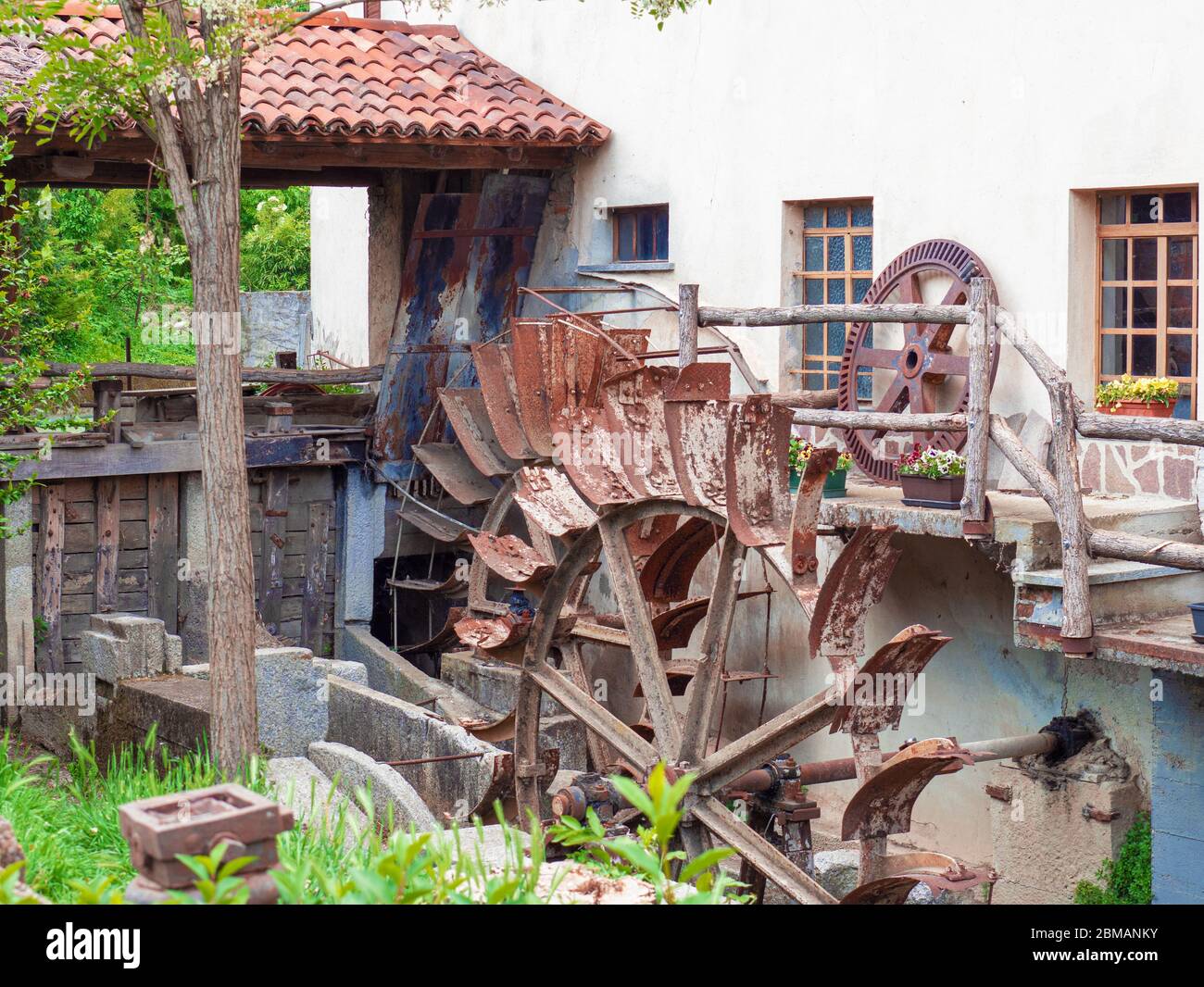 rusty wheel of a disused water mill Stock Photo - Alamy