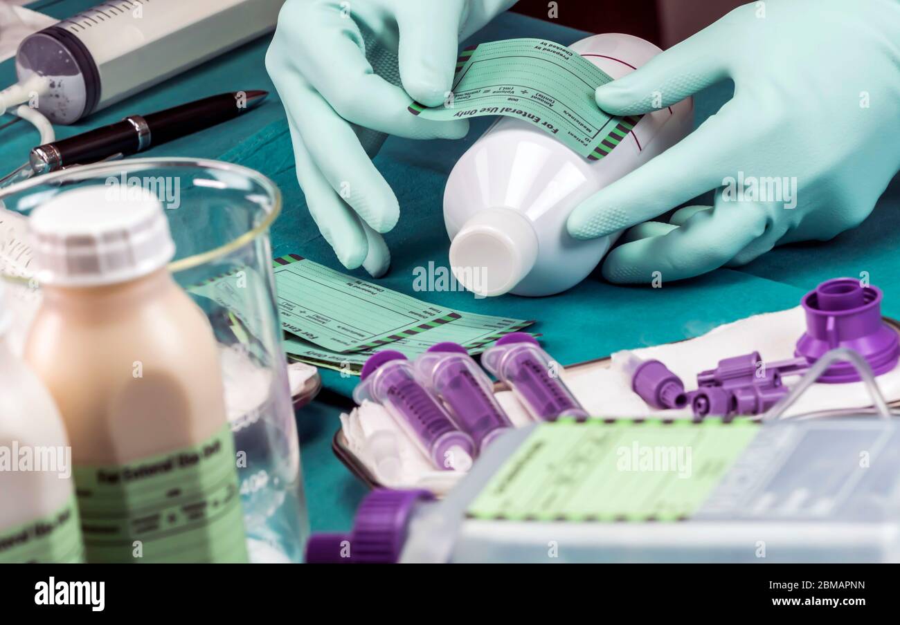 Nurse placed label on bottle of enteral nutrition, palliative care in ...