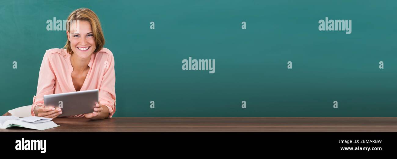 Happy Professor Teacher Elearning With Tablet And Green Chalkboard ...