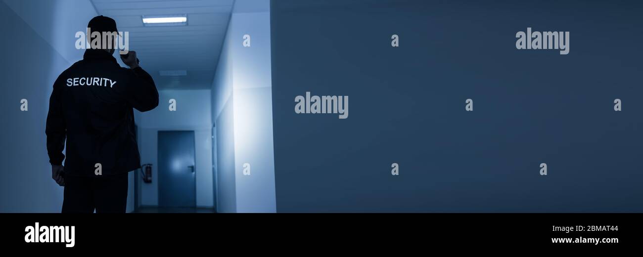 Security Guard Uniform Using Flashlight At Night Doing Surveillance ...