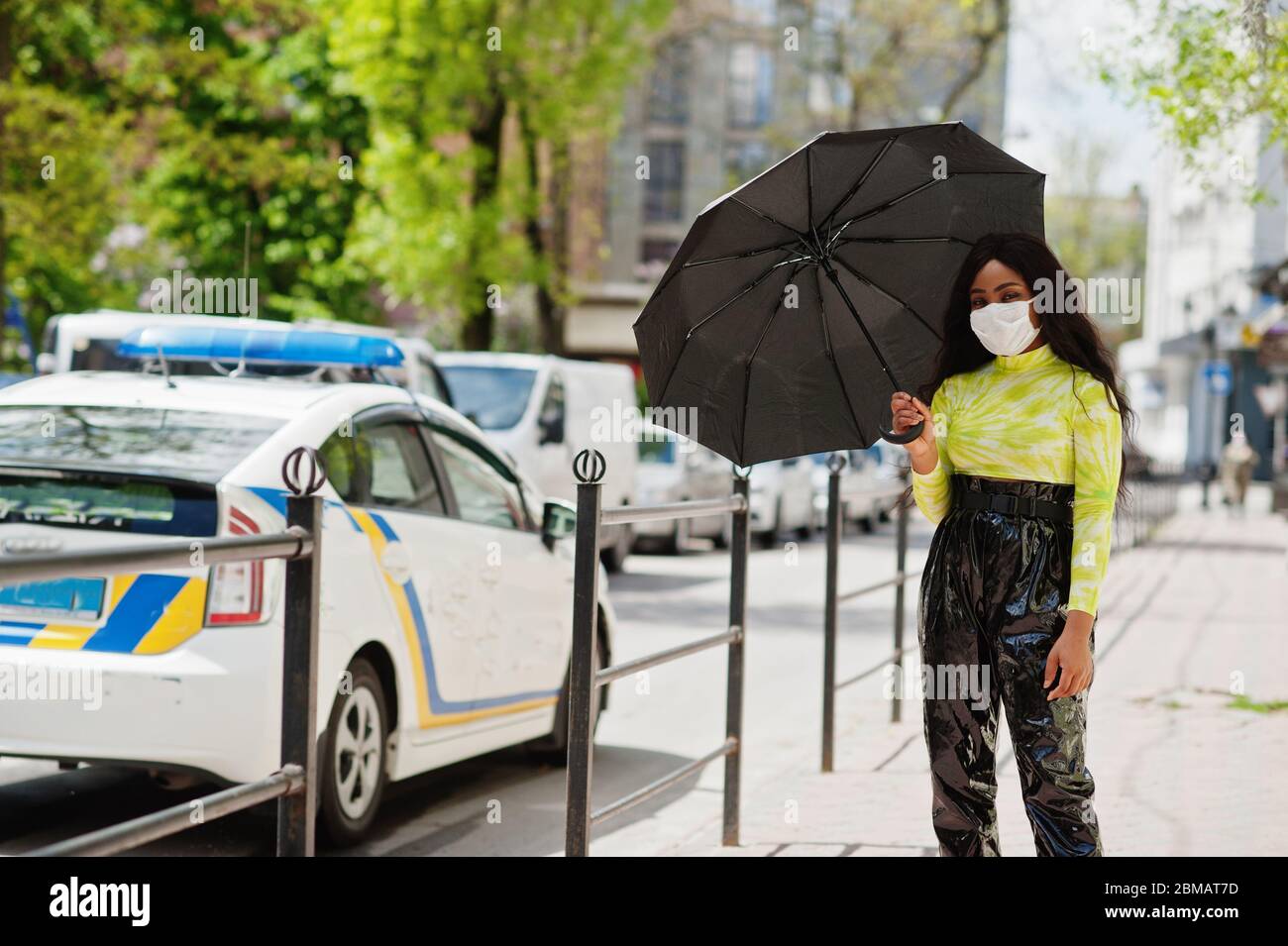 African American woman posing with facial mask to protect from ...
