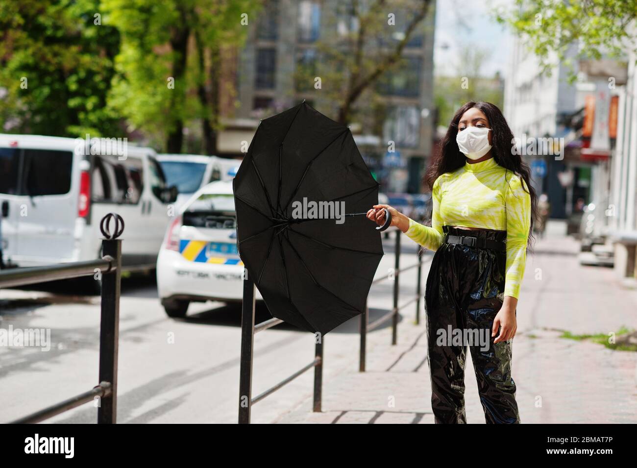 African American woman posing with facial mask to protect from ...