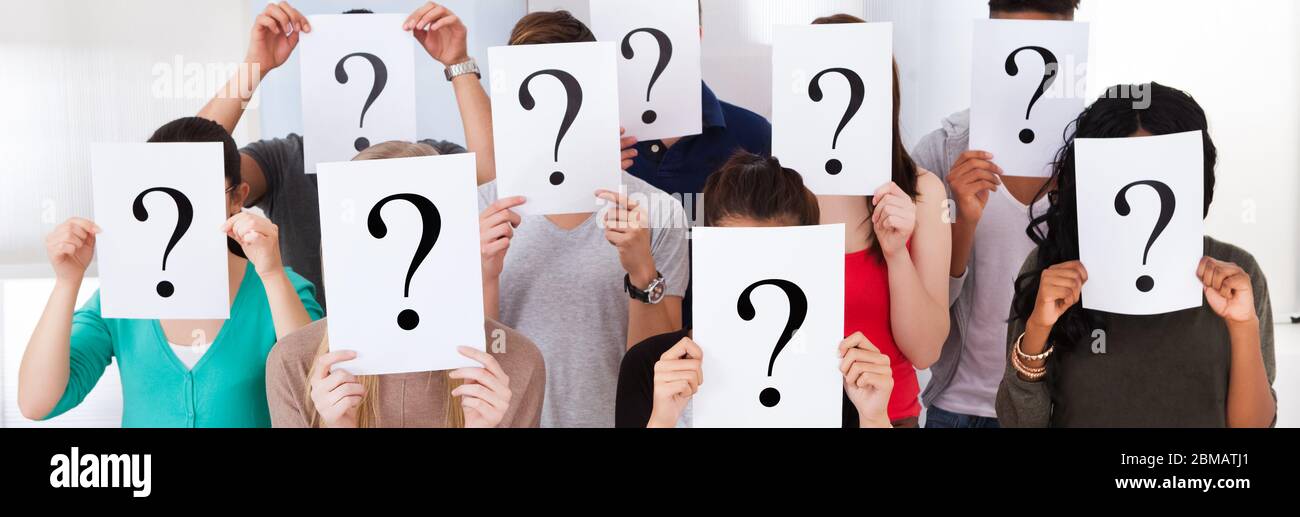 Confused Student Group Holding Question Marks Asking Questions Stock ...