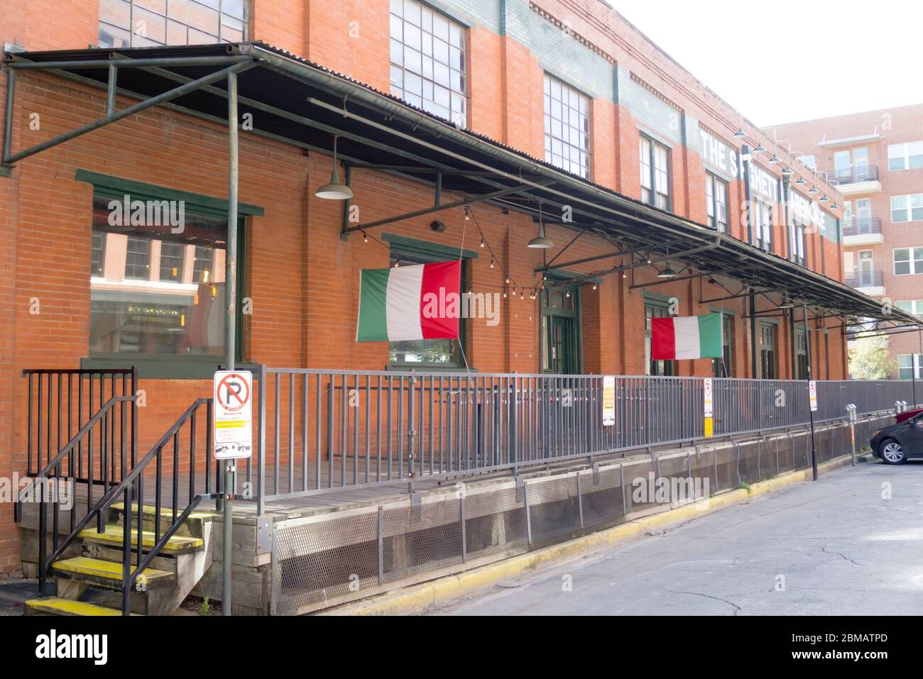 Italian Flag and Brick Warehouse Building in Dallas Stock Photo - Alamy