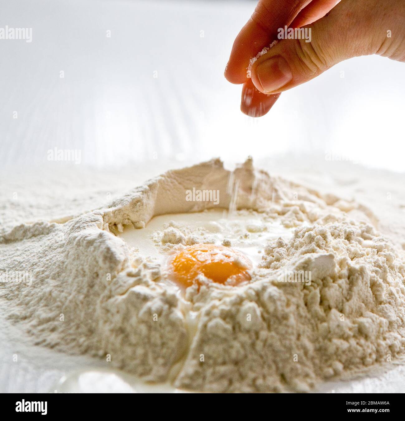 Adding salt cooking hi-res stock photography and images - Alamy