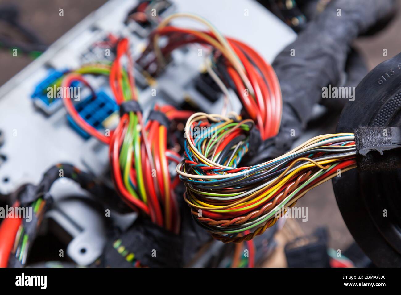 Bunch of multi-colored electrical wires - blue, green, red and yellow ...