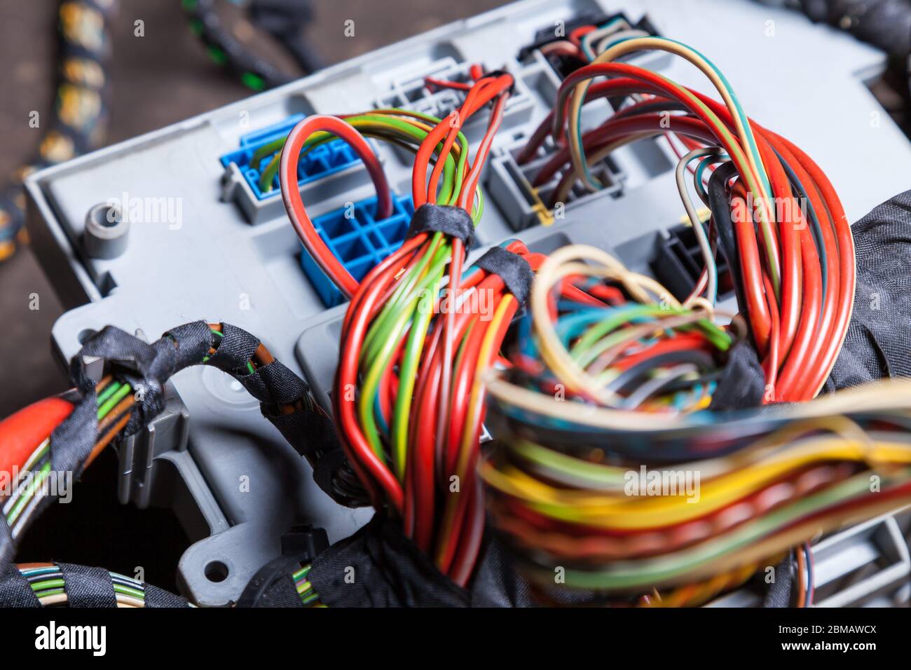 A bunch of multi-colored electrical wires - blue, green, red and yellow ...