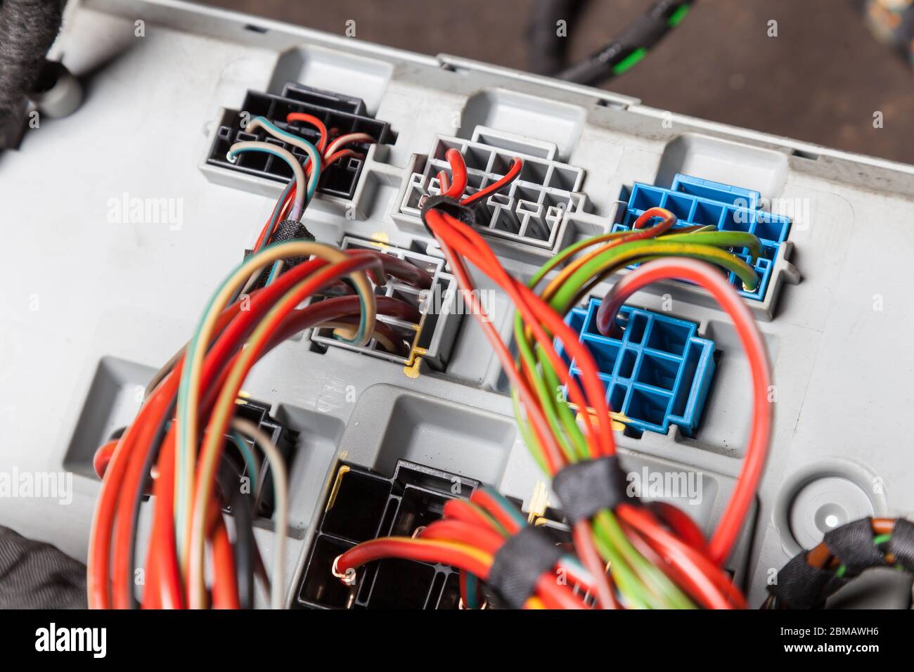 The back of the metal casing of the device with white, black and blue ...