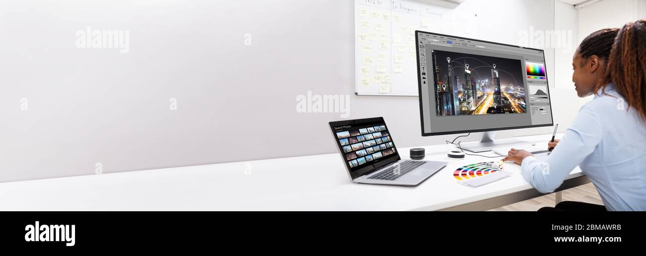 African Graphic Web Designer Doing Photo Design On Computer Stock Photo ...