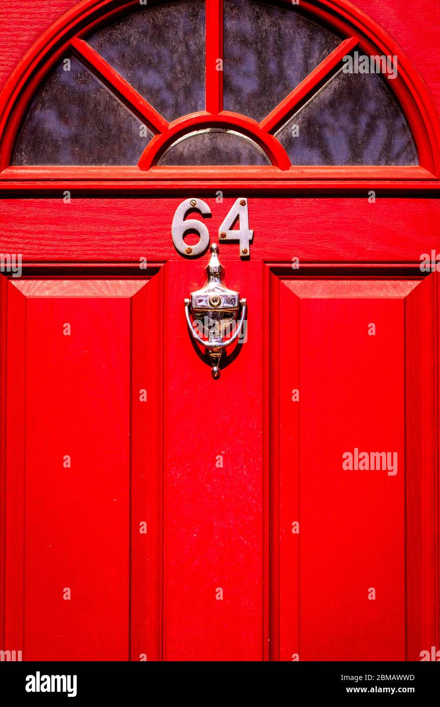 House number 64 on a red wooden front door Stock Photo - Alamy