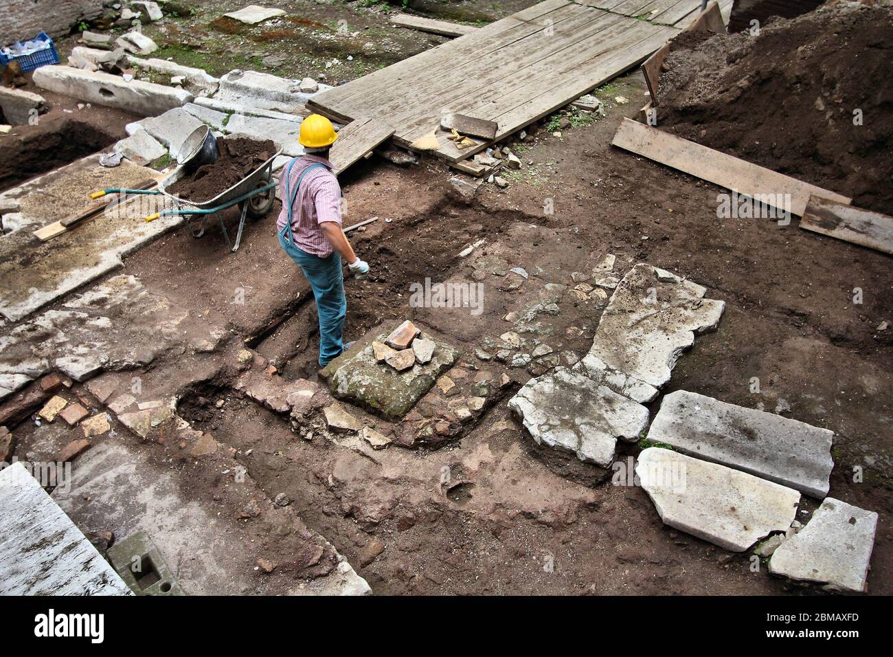 Rome, Italy - UNESCO World Heritage Site. Excavation worker digging ...