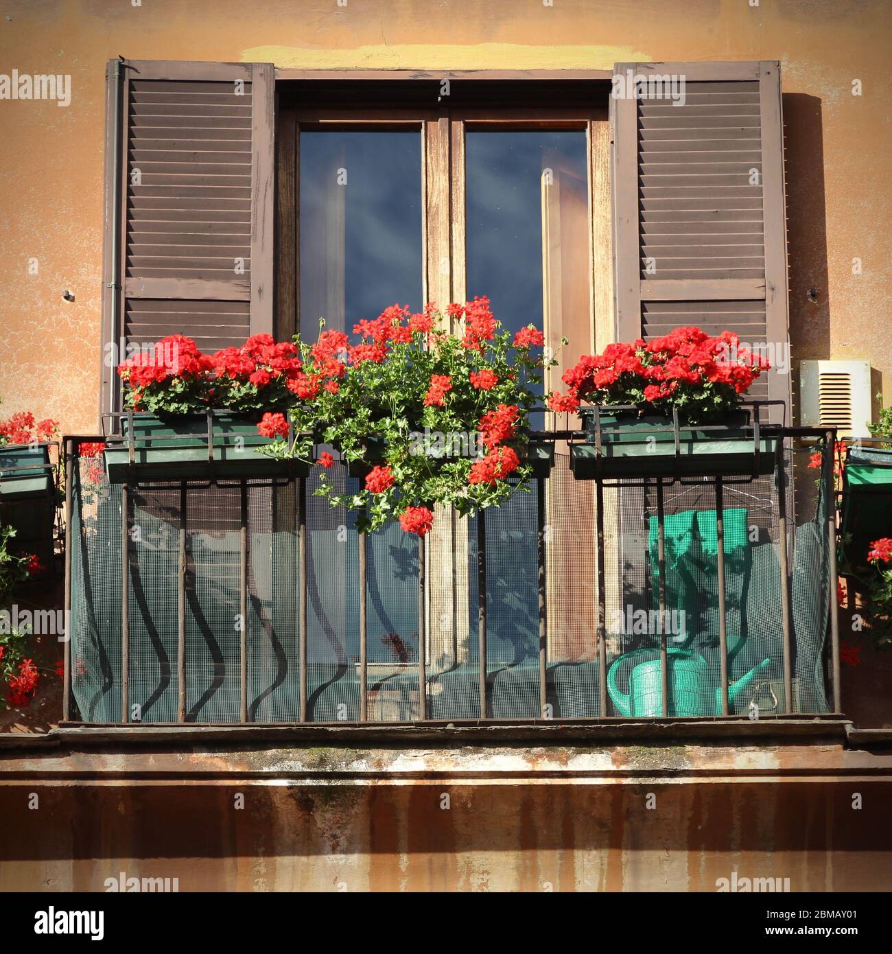 Rome, Italy. Beautiful window decorated with red flowers. Square ...