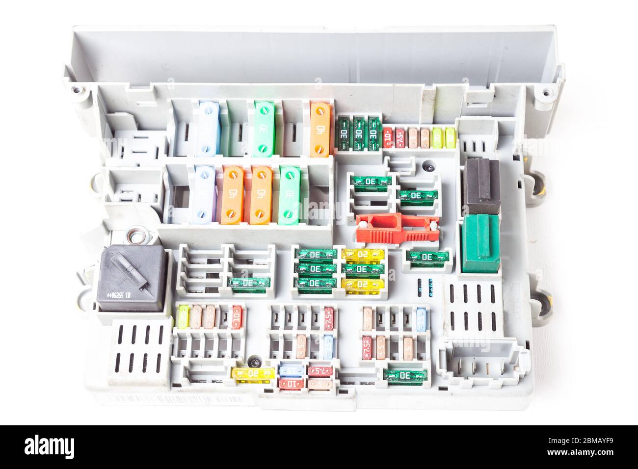 Automotive fuses on white panel with relay and multi-colored marked ...