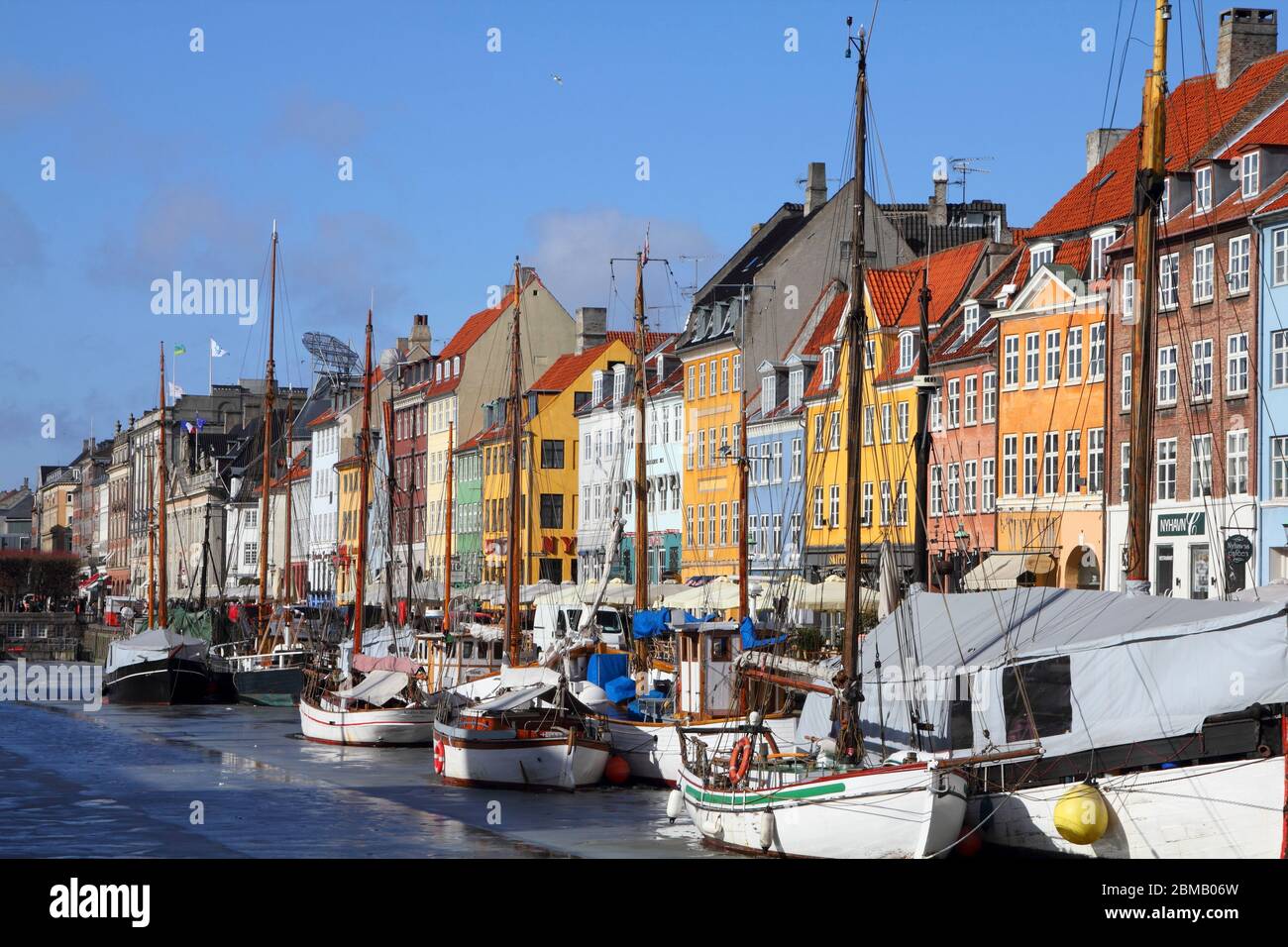 COPENHAGEN, DENMARK - MARCH 11, 2011: People visit Nyhavn district in ...