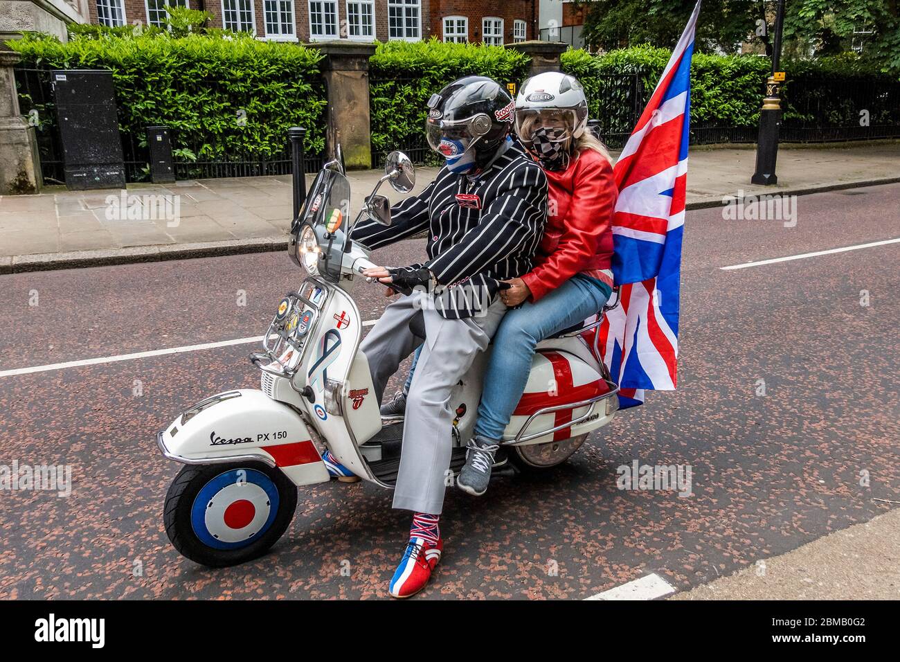 London, UK. 08th May, 2020. A veteran Mod and his partner take their ...