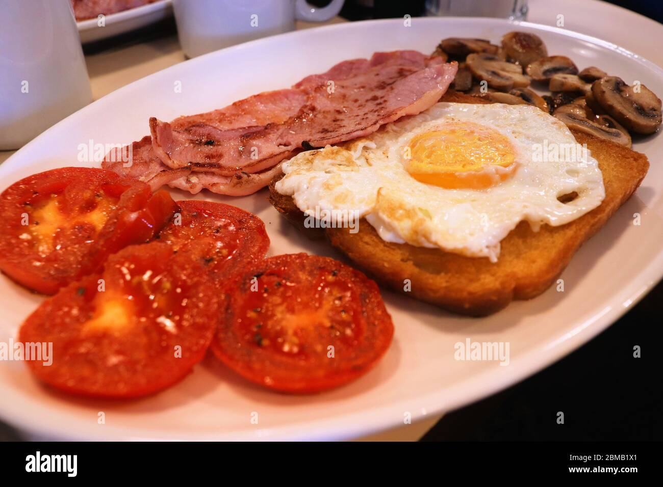 English breakfast. Traditional morning meal with toast, bacon ...