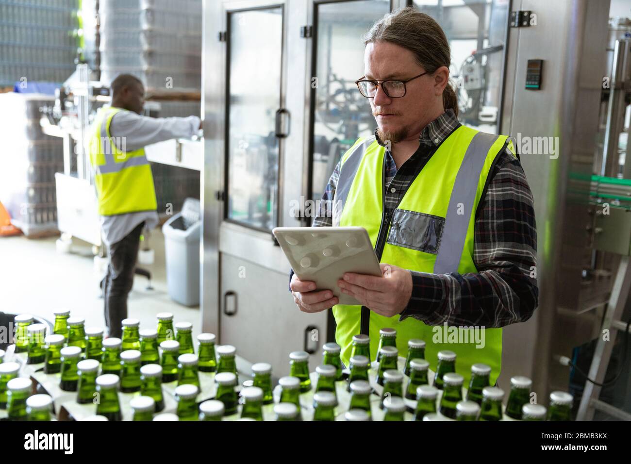 Brewery worker checking product hi-res stock photography and images - Alamy