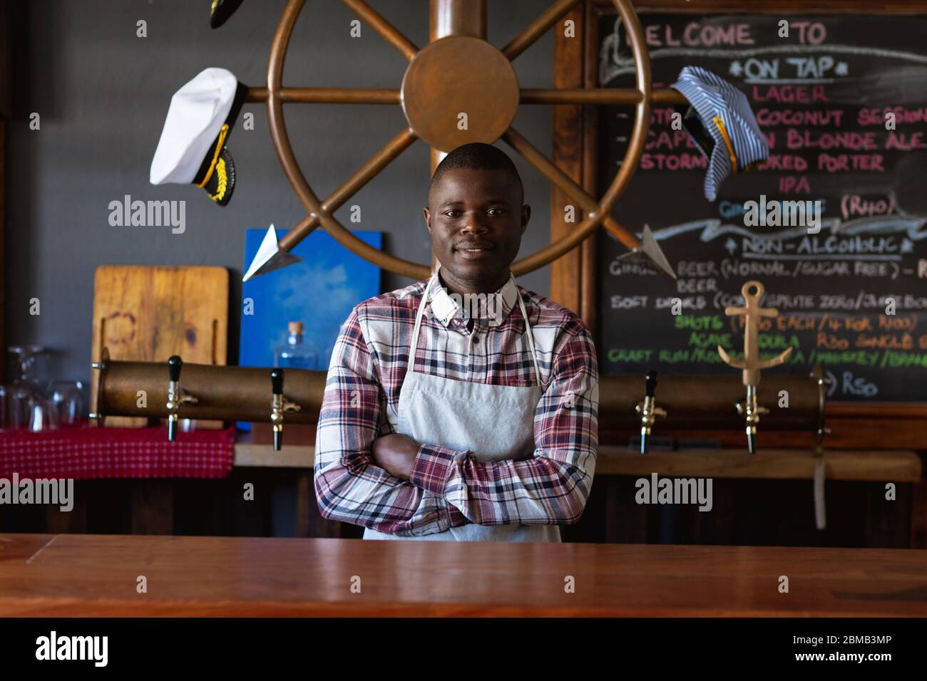 Portrait of an African American barman in a brewery Stock Photo - Alamy