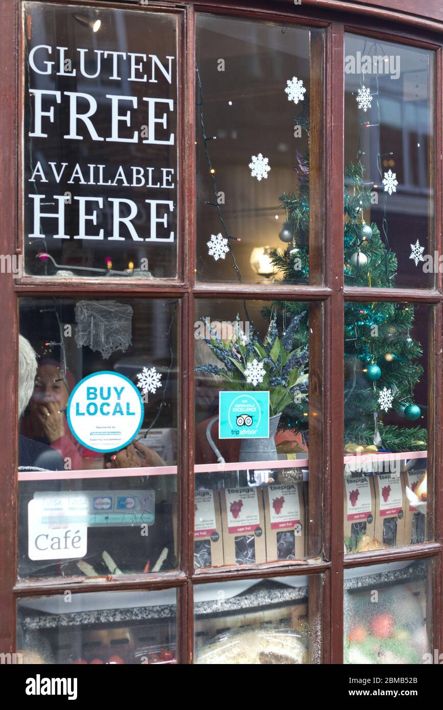 buy local, gluten free available here sign in shop window Stock Photo ...