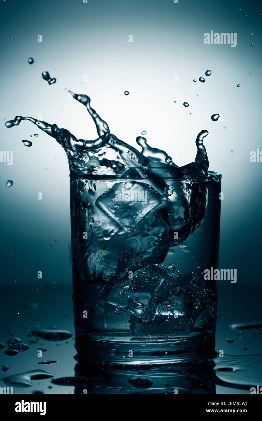 Ice drop with water splash hi-res stock photography and images - Alamy