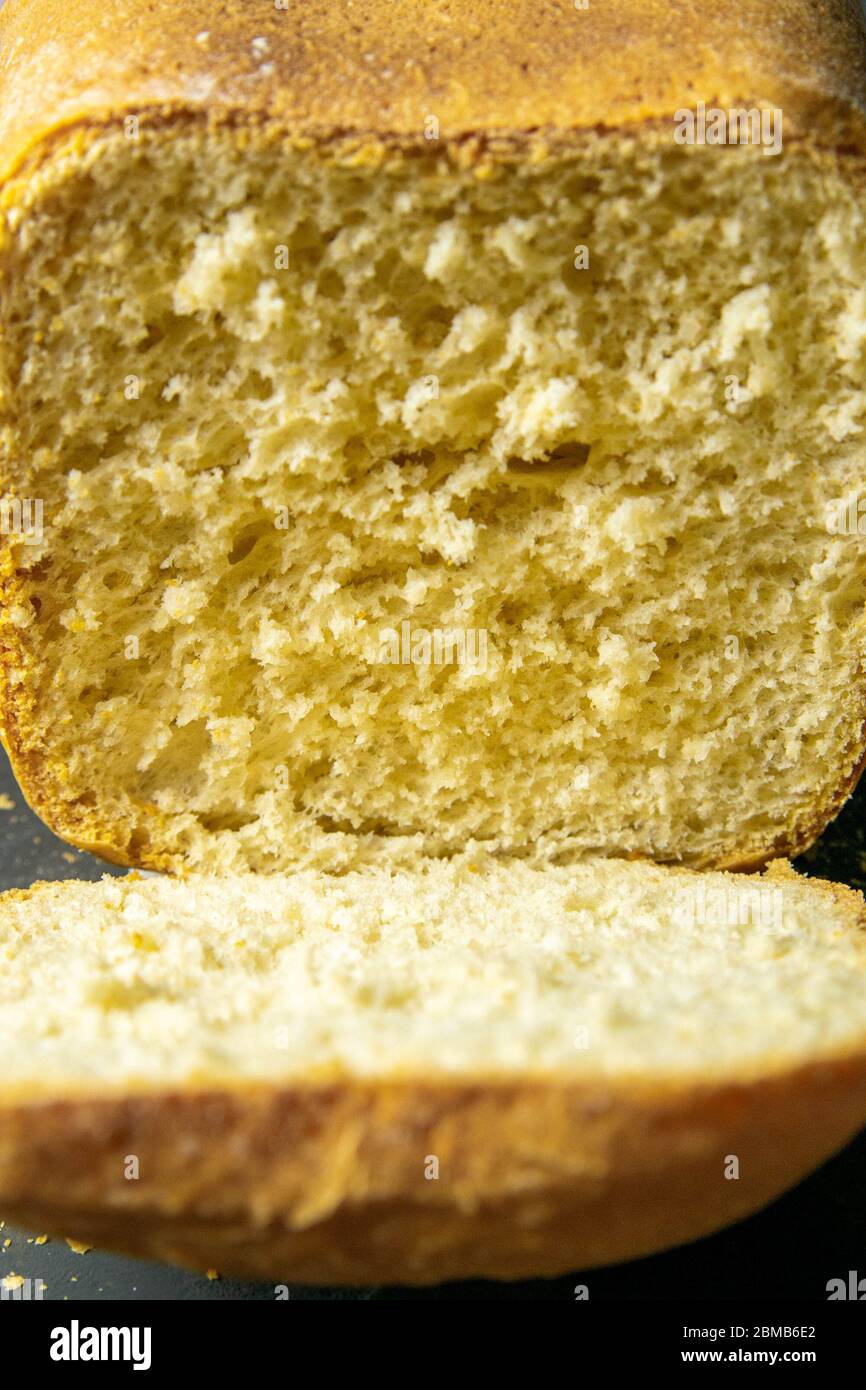 Fresh fragrant bread against a dark background. Assortment of baked ...