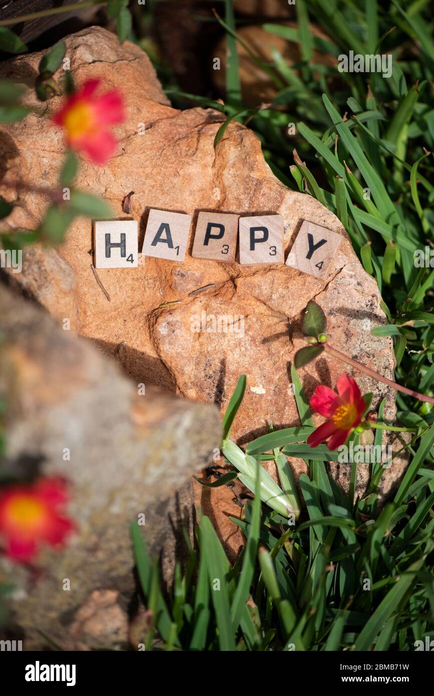 Happy in block letters Stock Photo - Alamy