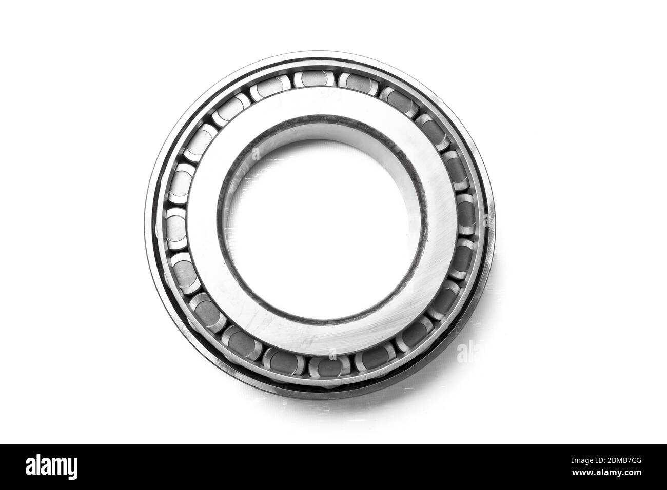 Single row tapered roller bearing made of shiny metal is designed to ...