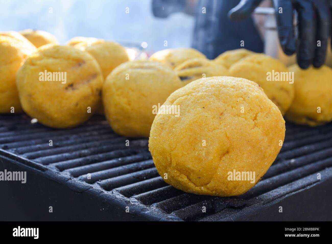Balls of polenta and cheese in the middle of it, named bulz, a ...