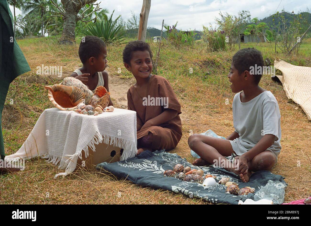 Children selling shells, Tau village, Viti Levu, Fiji Stock Photo - Alamy