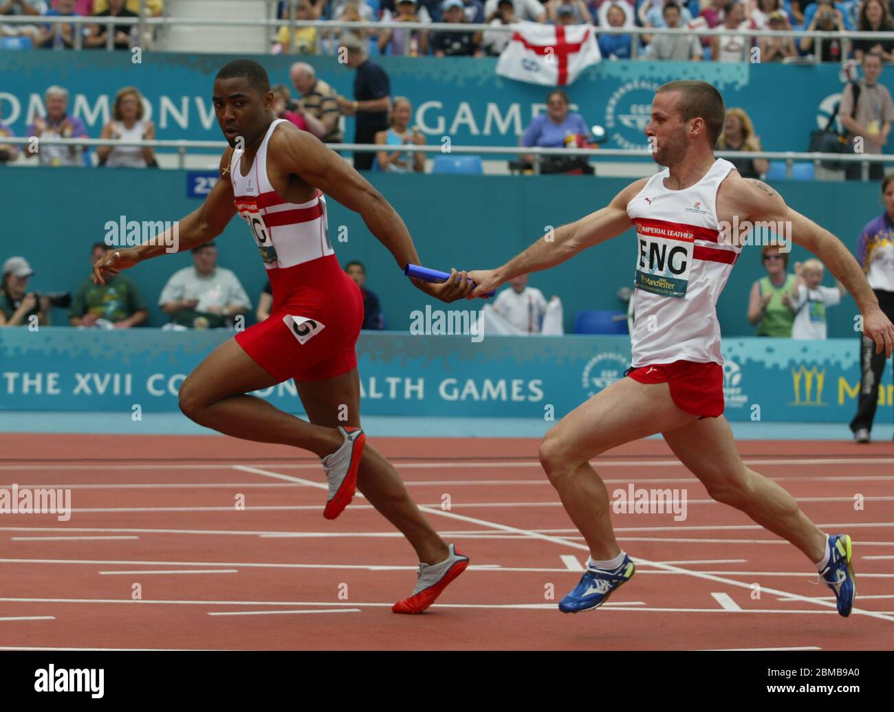 MANCHESTER - JULY 31: L-R Darren CAMPBELL of England takes the baton of ...