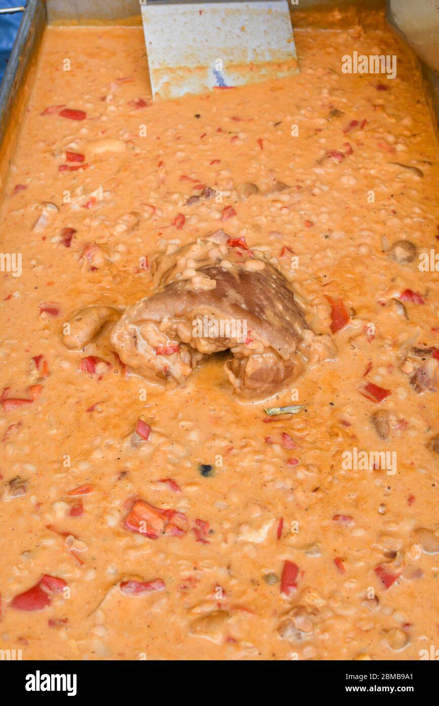 Beans stew, chili sin carne, large pot on fire cooking during food ...