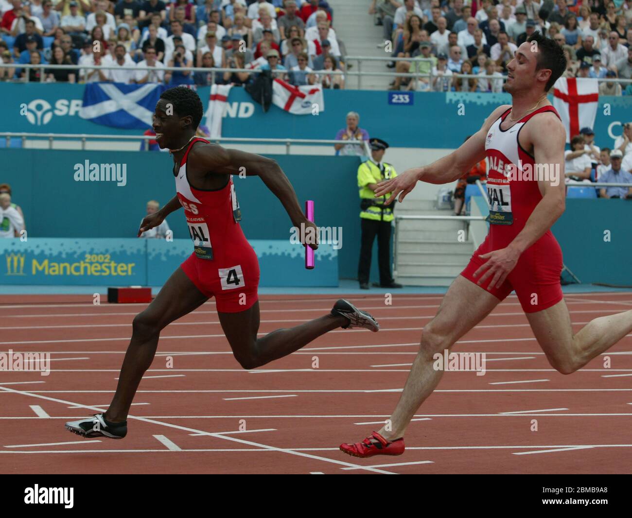 MANCHESTER - JULY 31: L-R Christian Malcolm of Wales takes the baton of ...