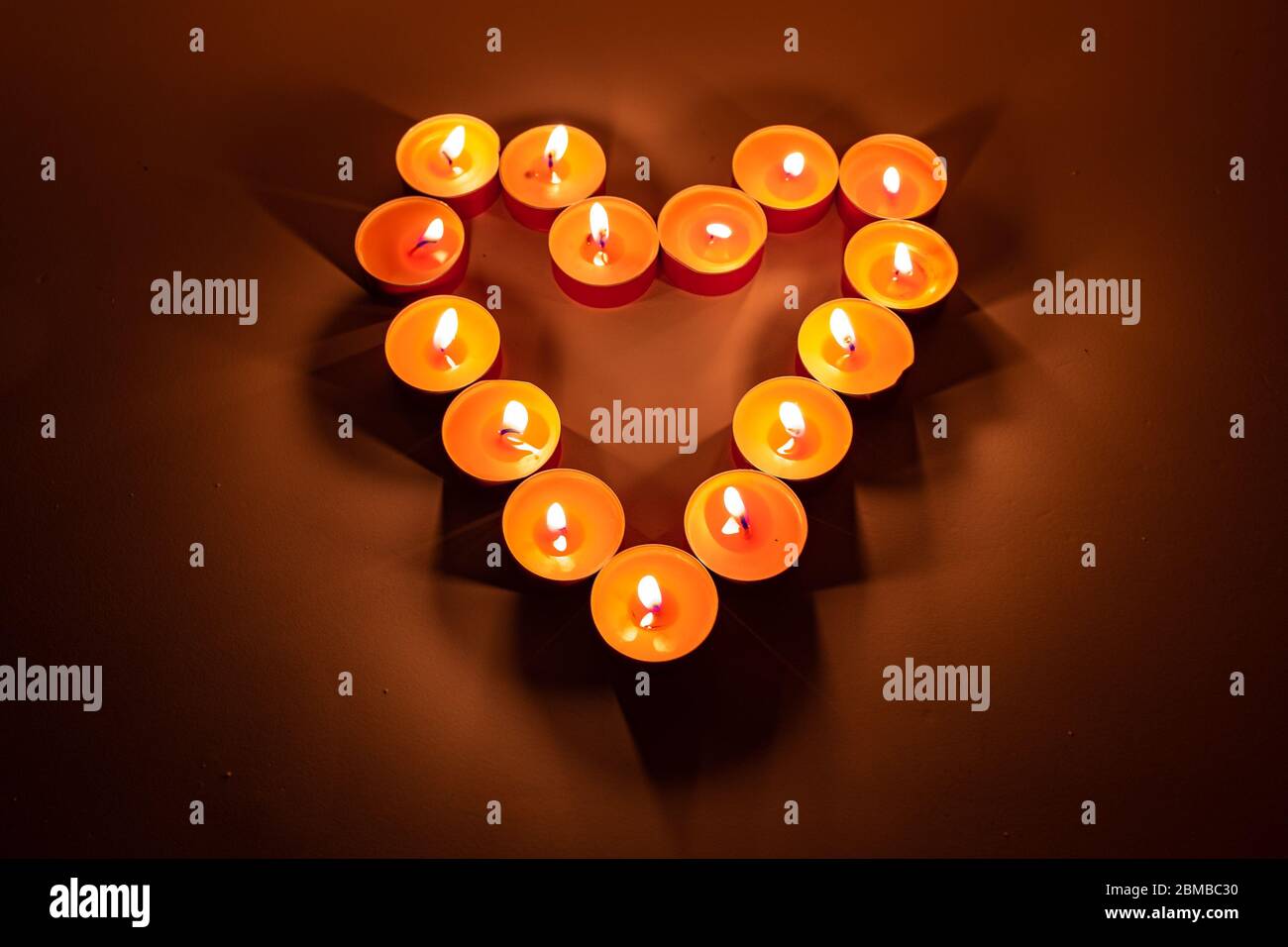 Romantic heart made of candles Stock Photo - Alamy