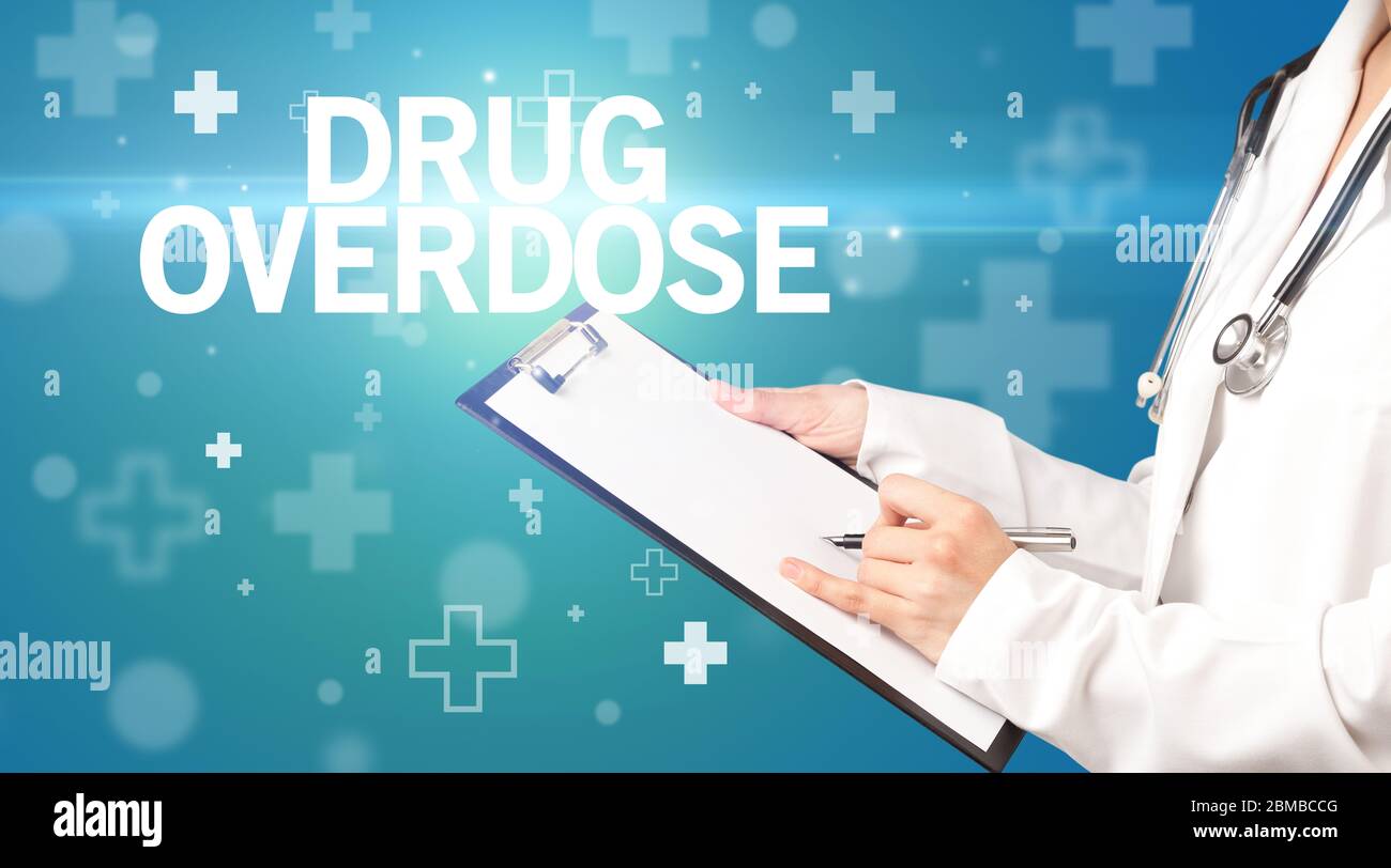 doctor writes notes on the clipboard with DRUG OVERDOSE inscription ...